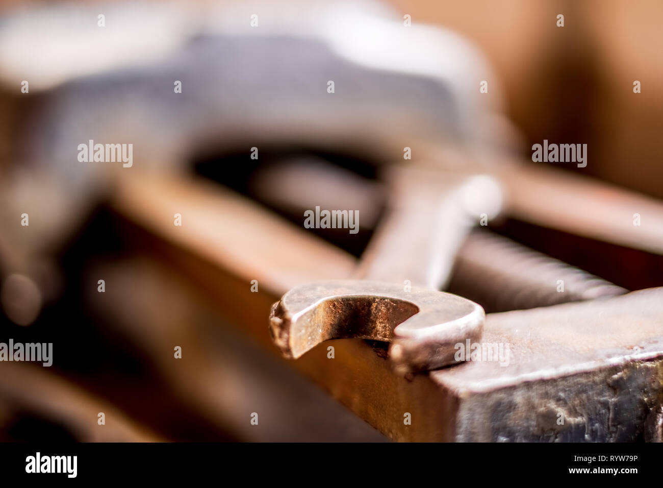 Rusty old vintage wrench on industrial equipment isolated Stock Photo ...