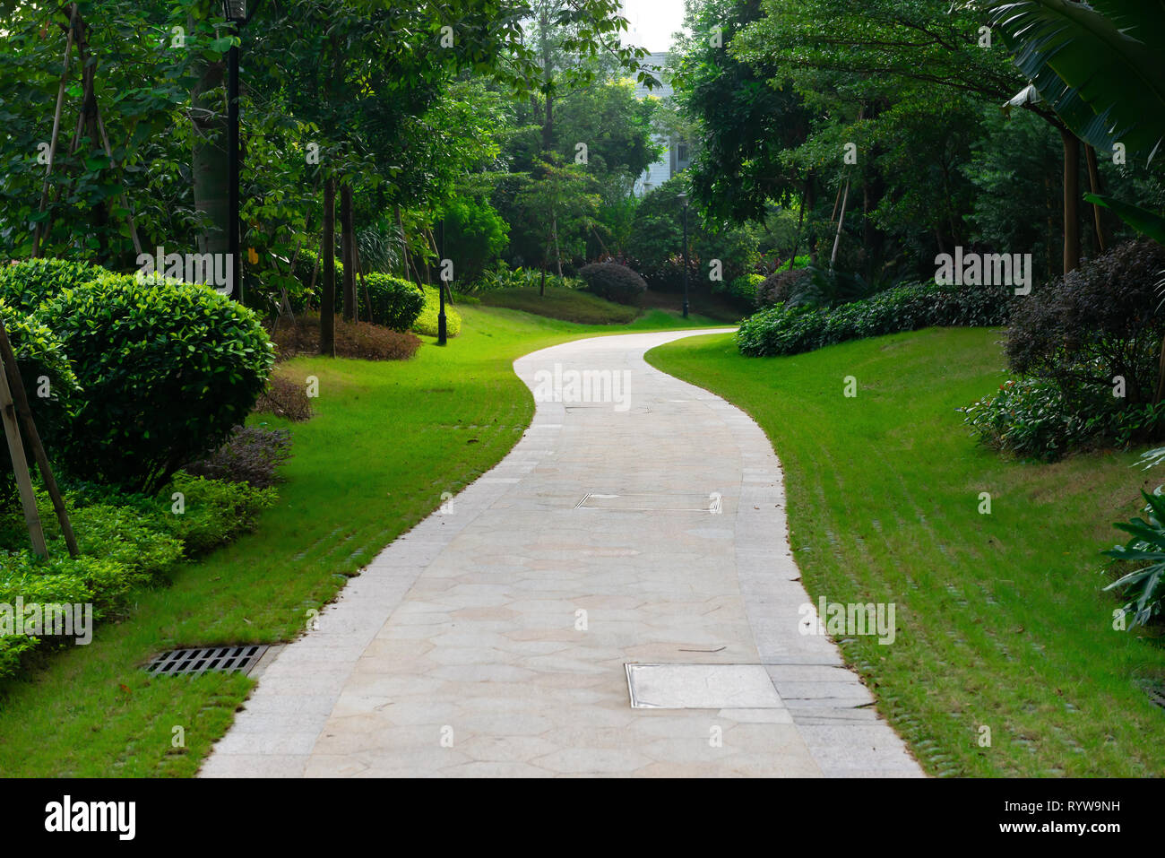 curved outdoor pathway in a park Stock Photo - Alamy