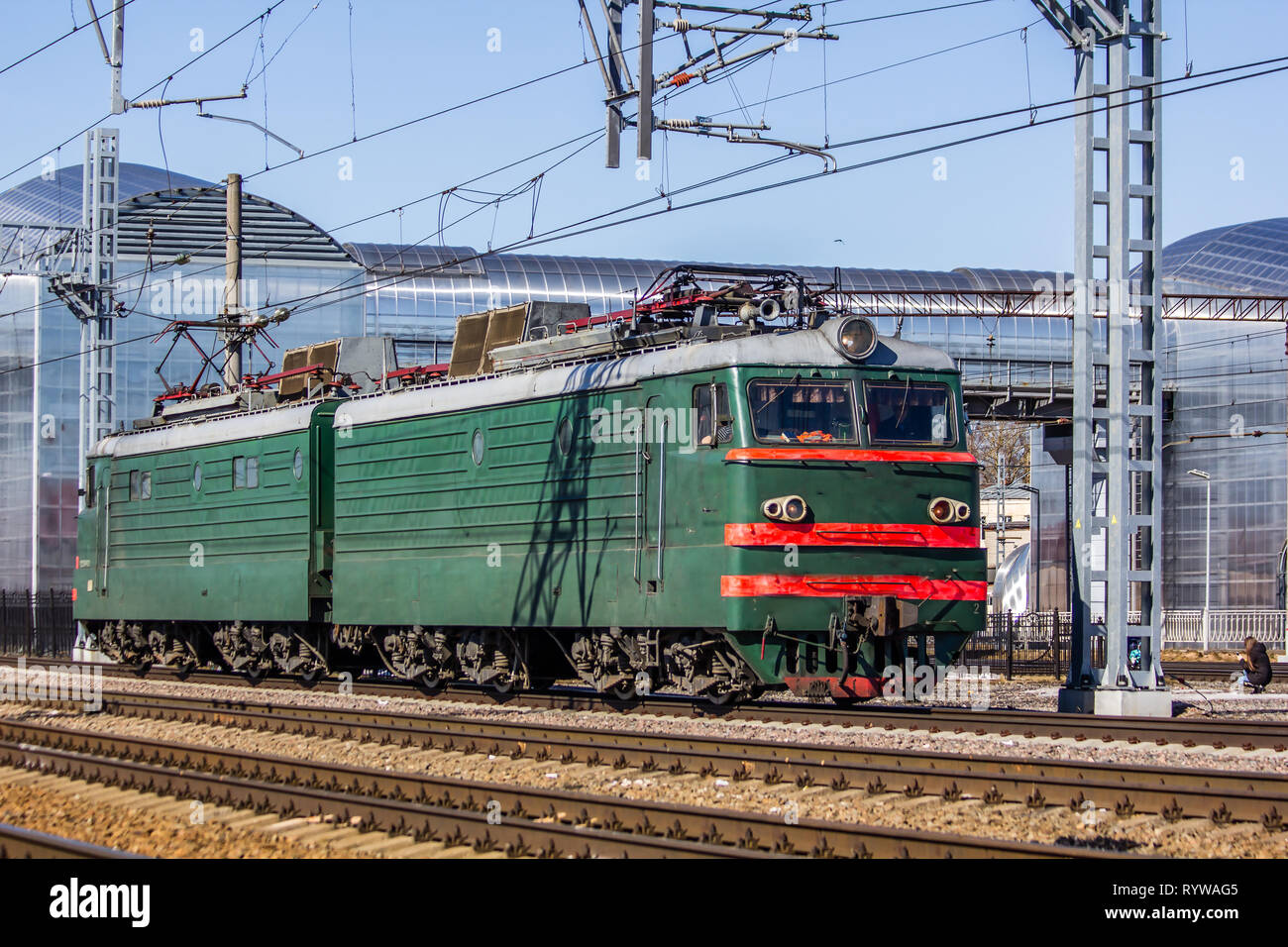 Electric locomotive on the railway. Locomotive rides by rail. Station ...