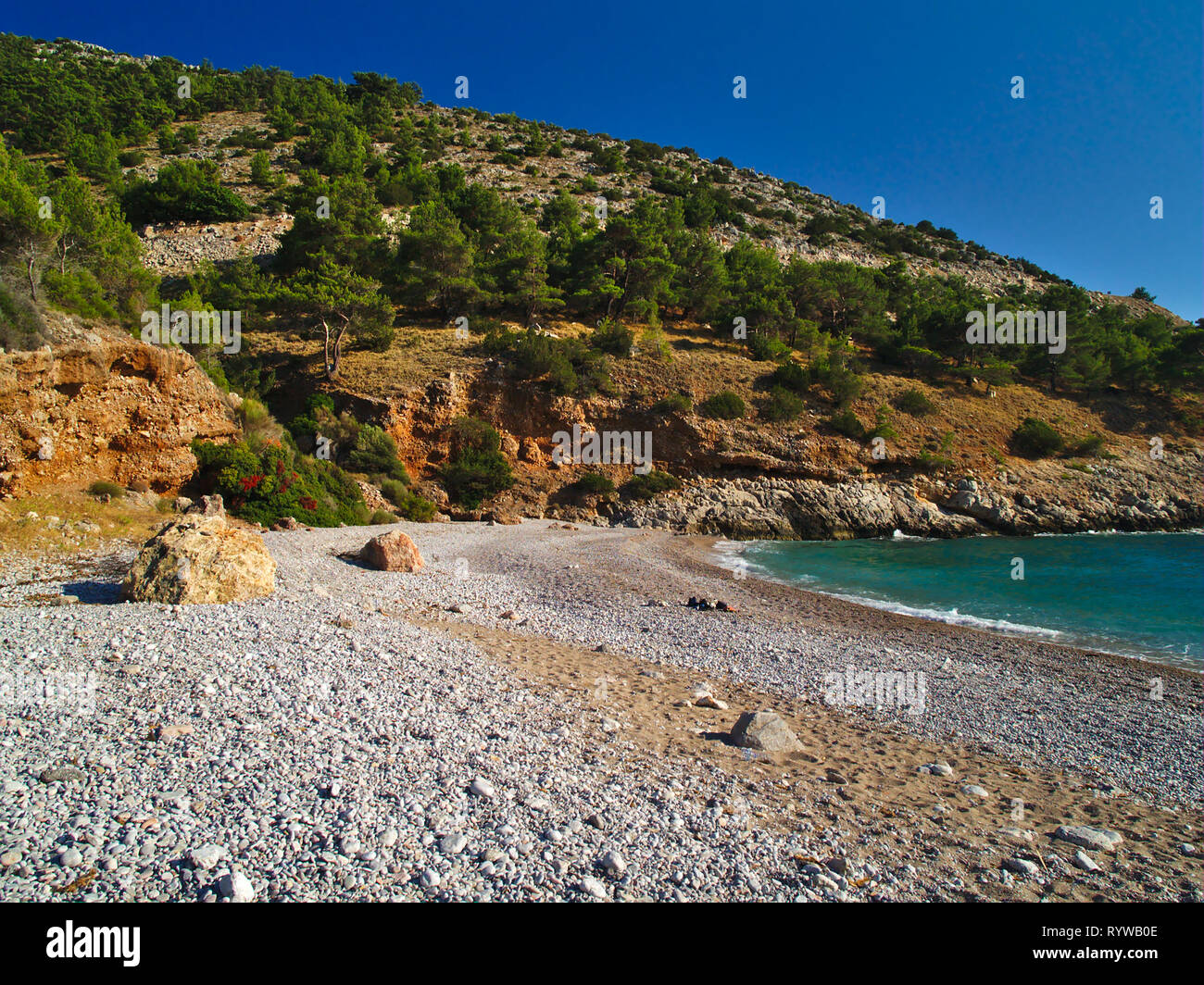 Isolated empty beautiful stone beach at summer time, in central west ...