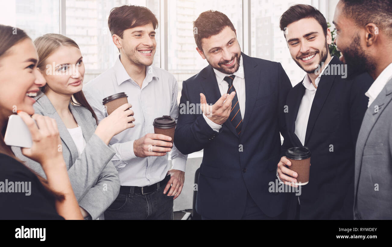 Team having small talk at their coffee break Stock Photo - Alamy