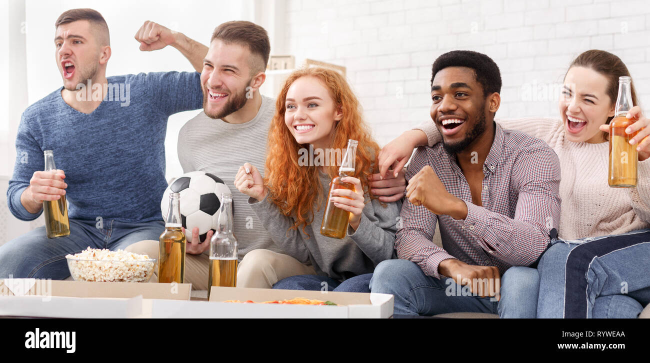 Diverse friends watching football match on tv Stock Photo - Alamy