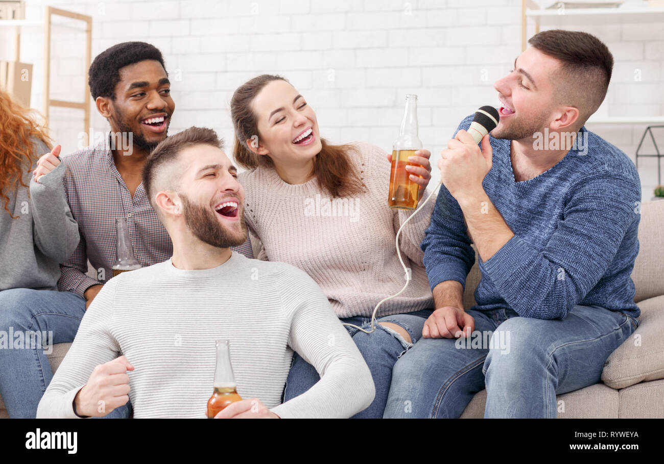 Friends having fun, singing songs together at home Stock Photo - Alamy