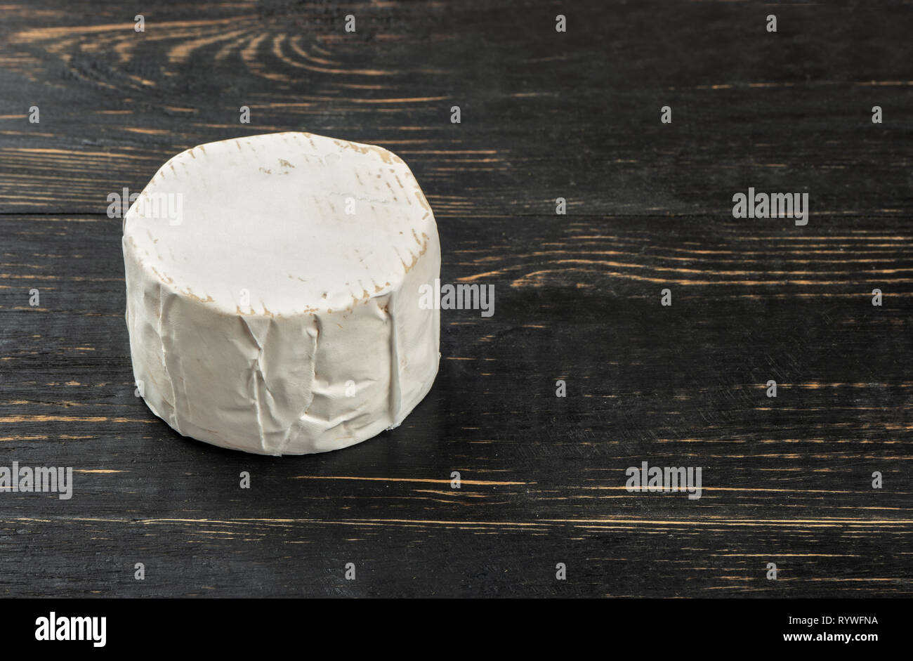 Brie cheese with mold on wooden background Stock Photo - Alamy