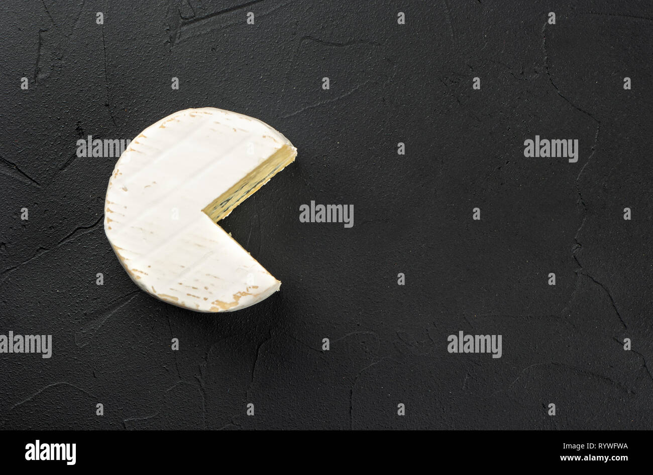 Piece brie cheese with mold on dark background, top view Stock Photo ...