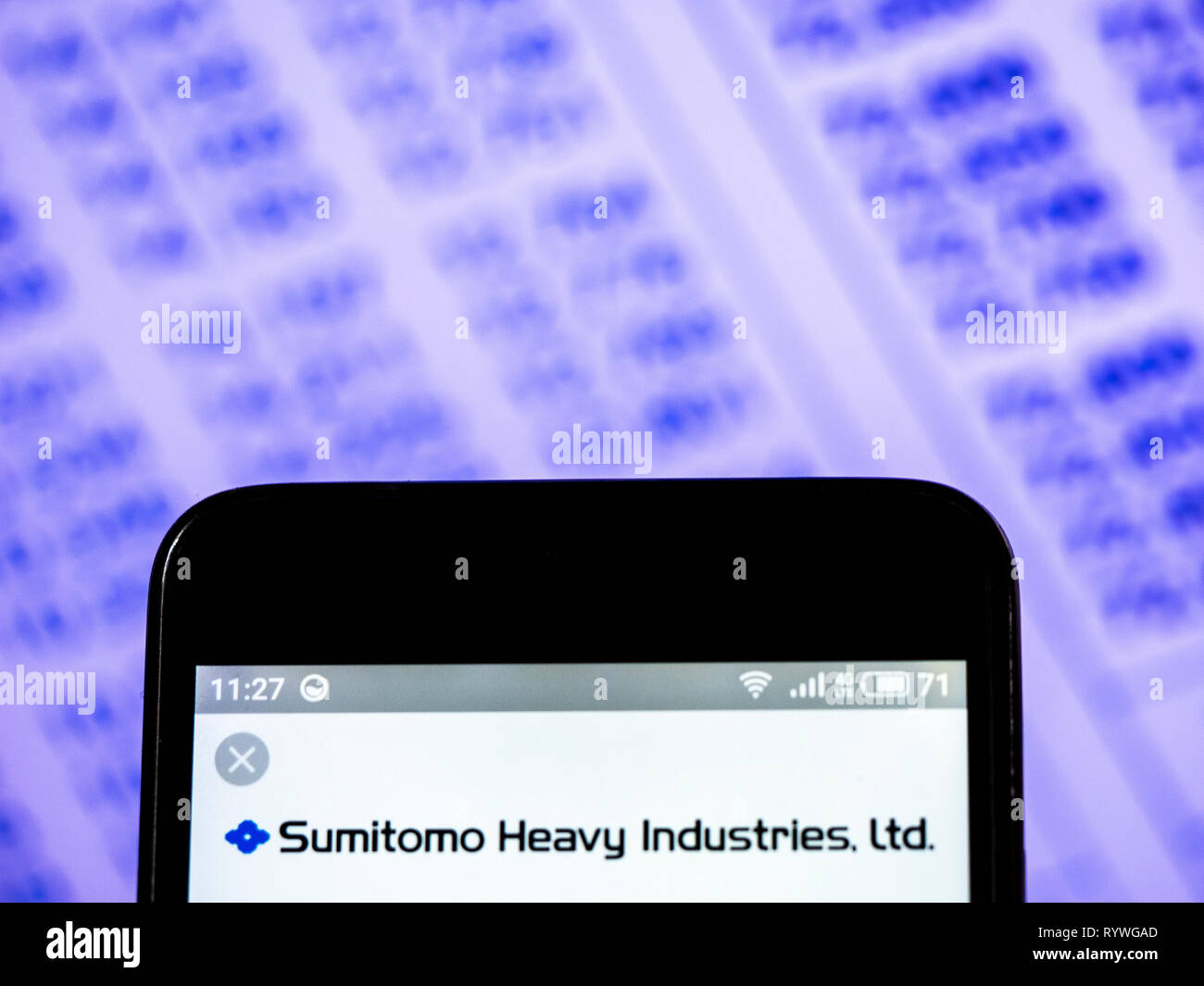Sumitomo Heavy Industries, Ltd. company logo seen displayed on smart ...