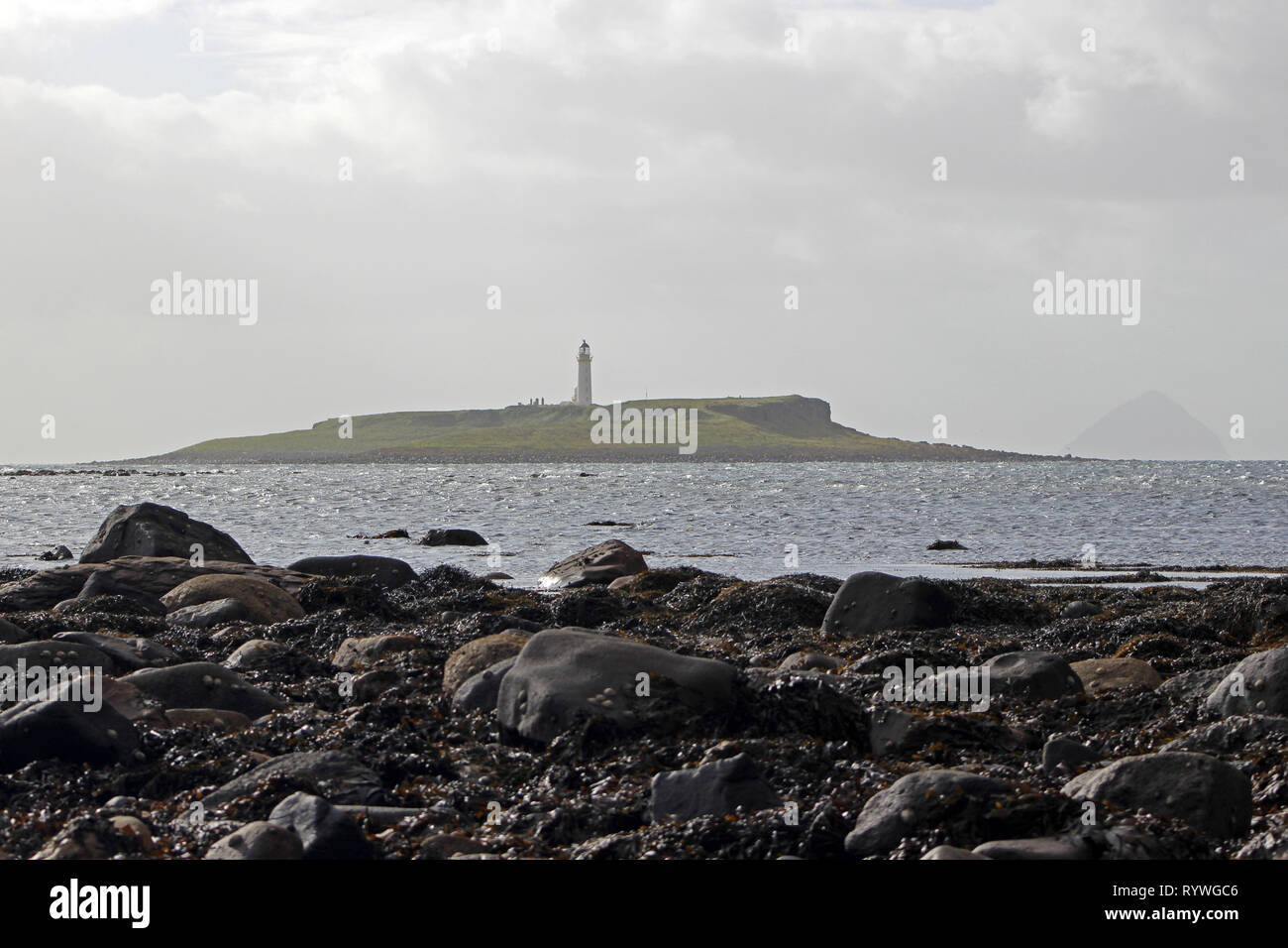 Pladda lighthouse viewed from Kildonan beach on the southern tip Of ...