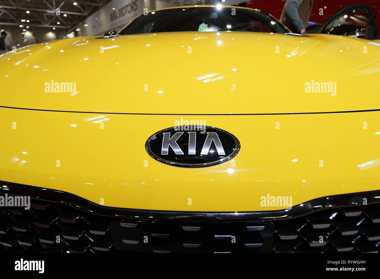 Bucharest, Romania - October 21, 2018: The logo of an yellow Kia car is ...
