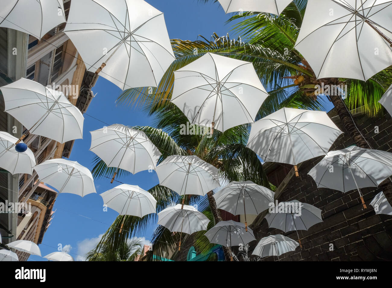 White umbrellas urban street decoration of Old Town in Port Louis ...