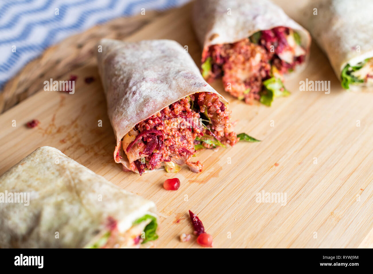 Organic Healthy Wraps with salad, quinoa, grilled chicken, red cabbage ...