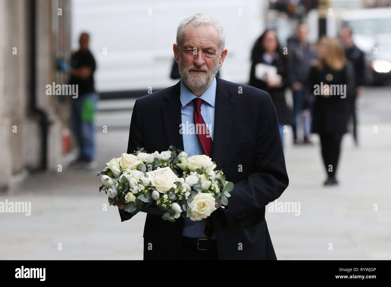 Labour leader Jeremy Corbyn carries a wreath as he arrives at the New ...
