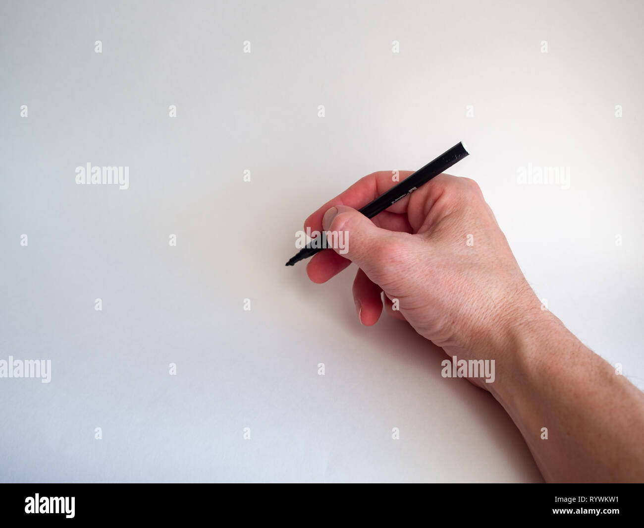 The person holds in hand the handle on a white background Stock Photo ...