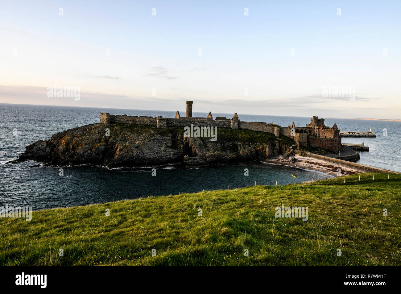 The ruins of St. German Cathedral within Peel castle on St Patrick's Isle connected by a ...