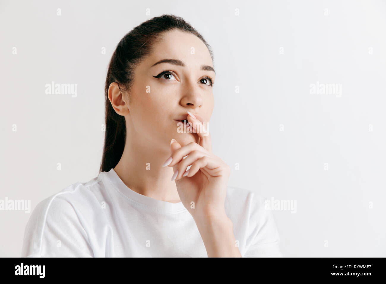 Remember all. Let me think. Doubt concept. Doubtful, thoughtful woman ...