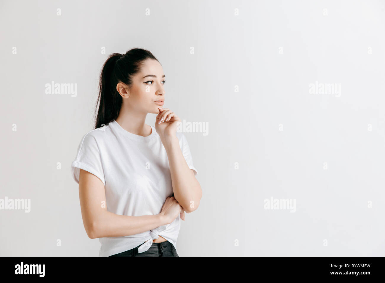 Remember all. Let me think. Doubt concept. Doubtful, thoughtful woman ...