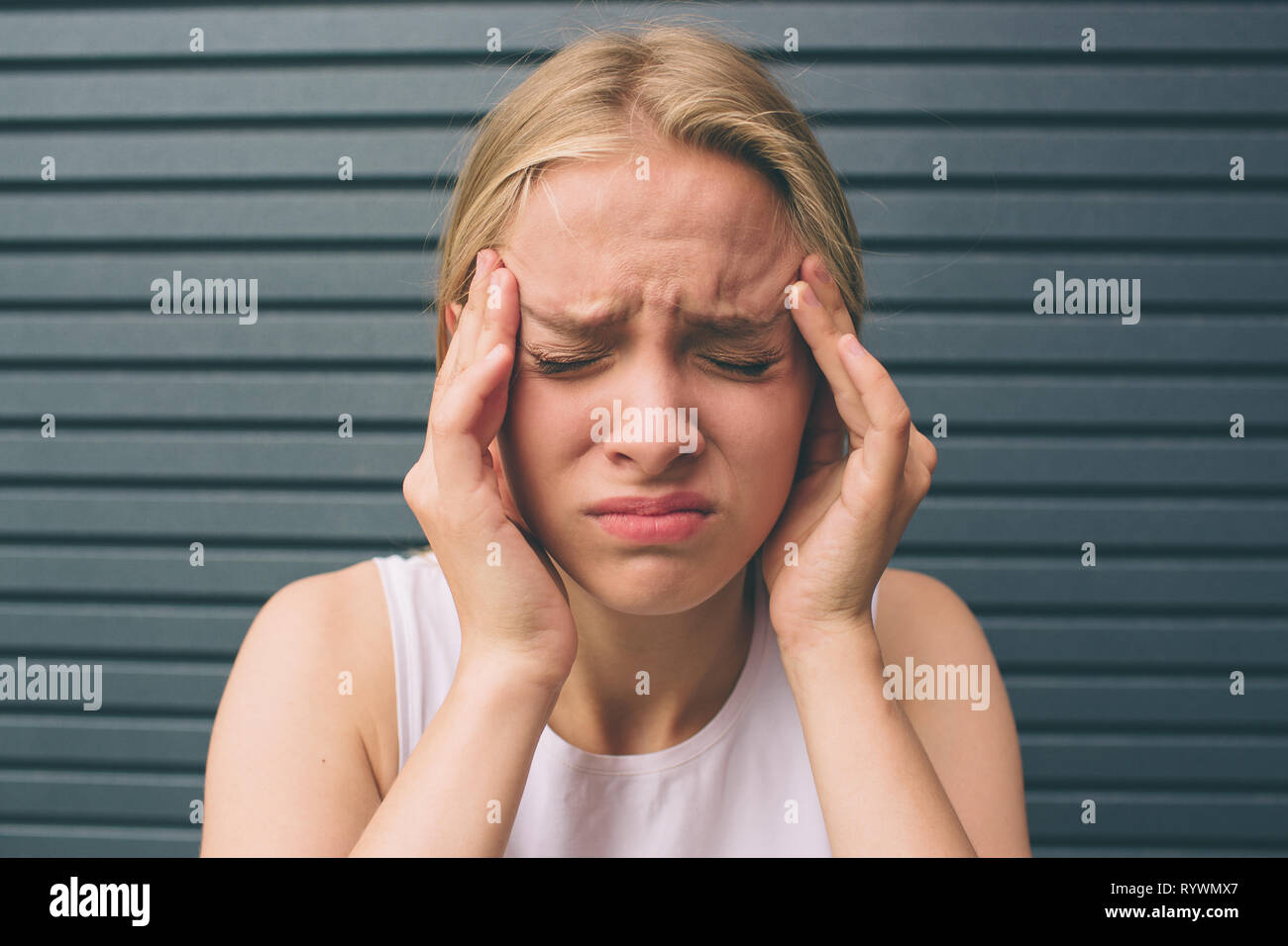 Beautiful blonde girl on the background , angry screaming woman ...