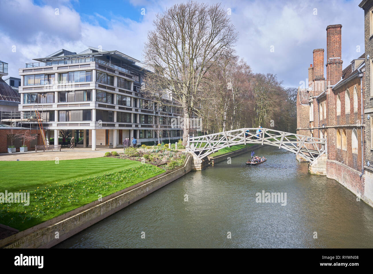 Punting along the river Cam under the wooden bridge (known as the ...