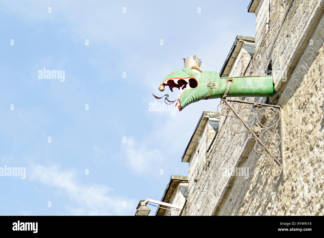 Rain gutter decorated with dragon gargoyle head on the Town Hall of ...