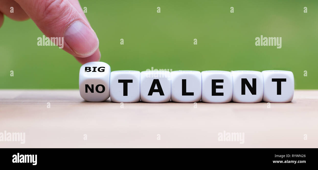 Hand turns a dice and changes the expression "no talent" to "big talent ...
