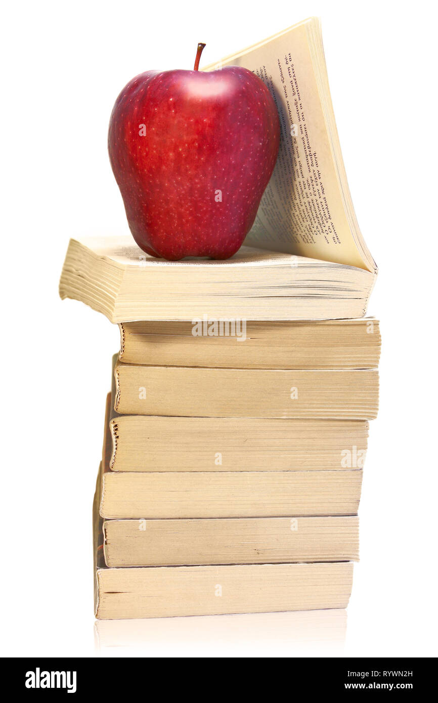 Stack of books with red apple isolated on white Stock Photo - Alamy