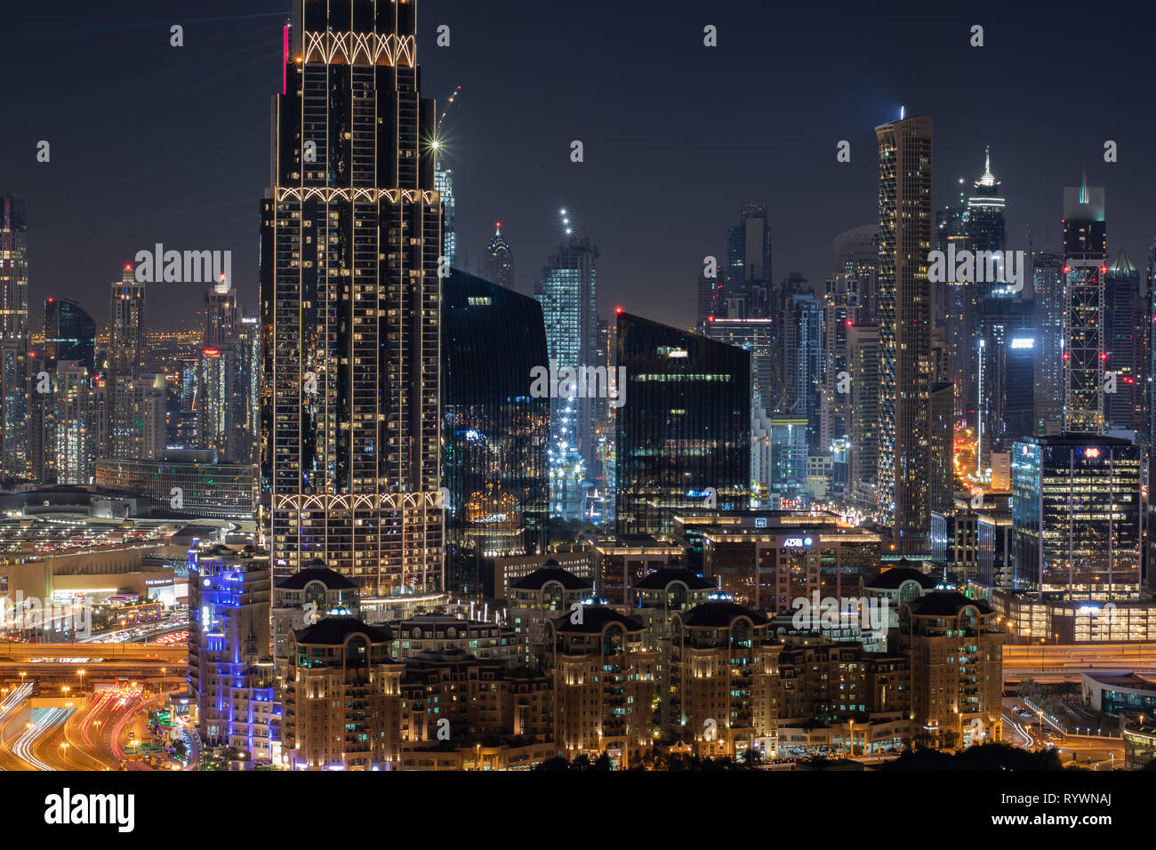 Colourful night time view of downtown Dubai Stock Photo - Alamy