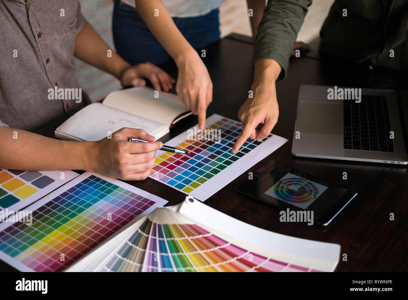 Graphic designers choose colors from the color bands samples for design ...