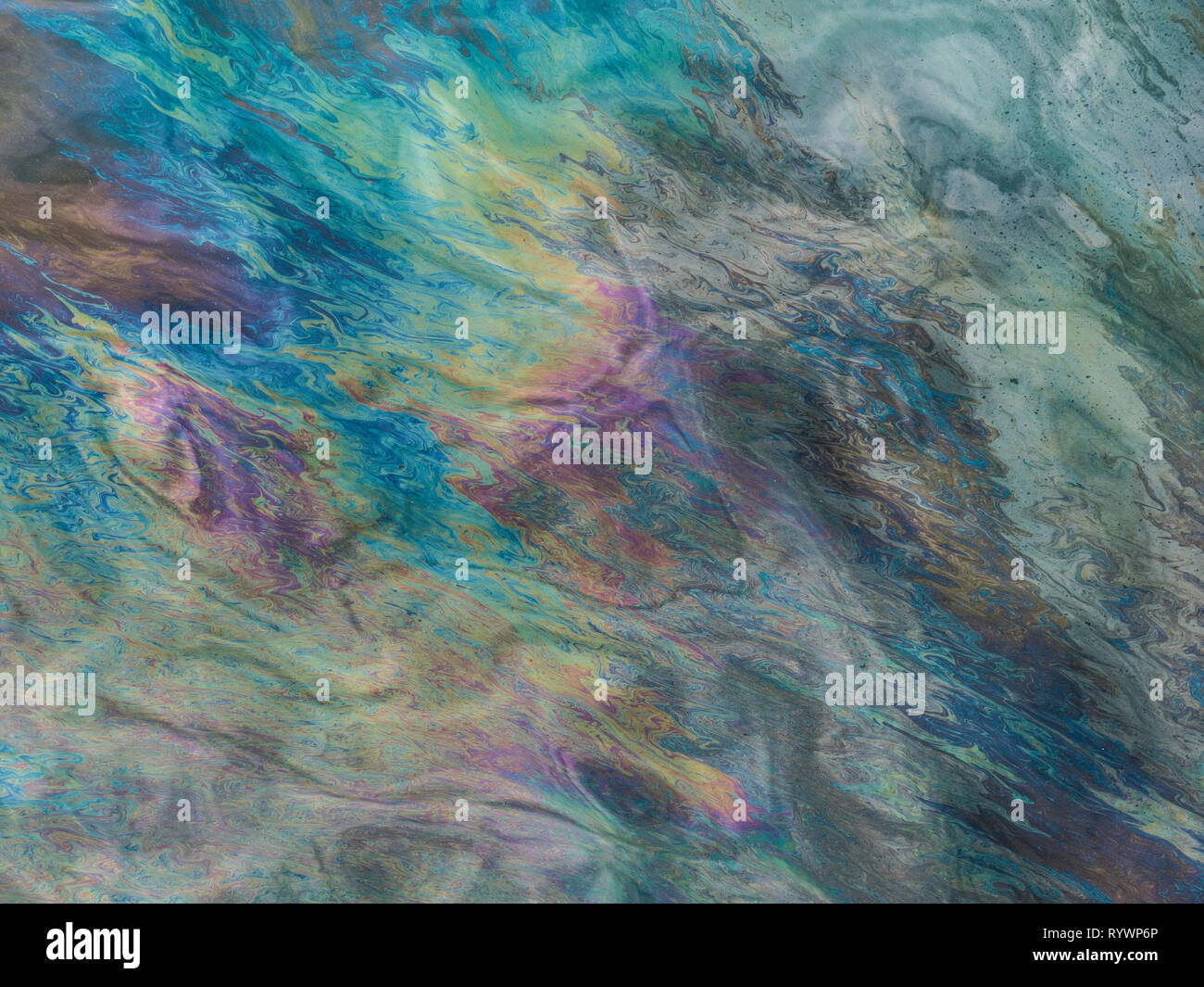 Discharge of oil on water level Stock Photo - Alamy