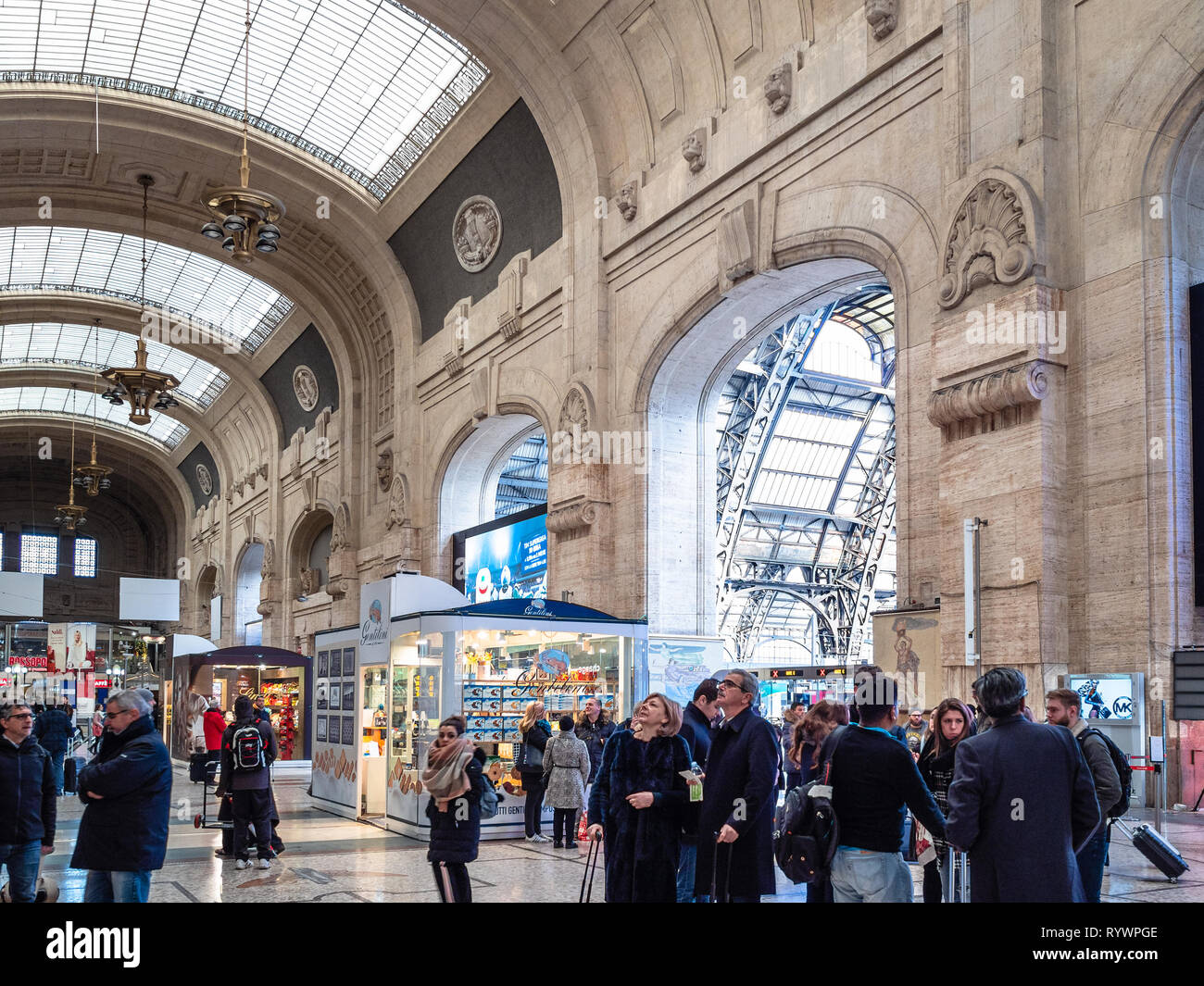 MILAN, ITALY - FEBRUARY 24, 2019: passengers in hall of Stazione Milano ...