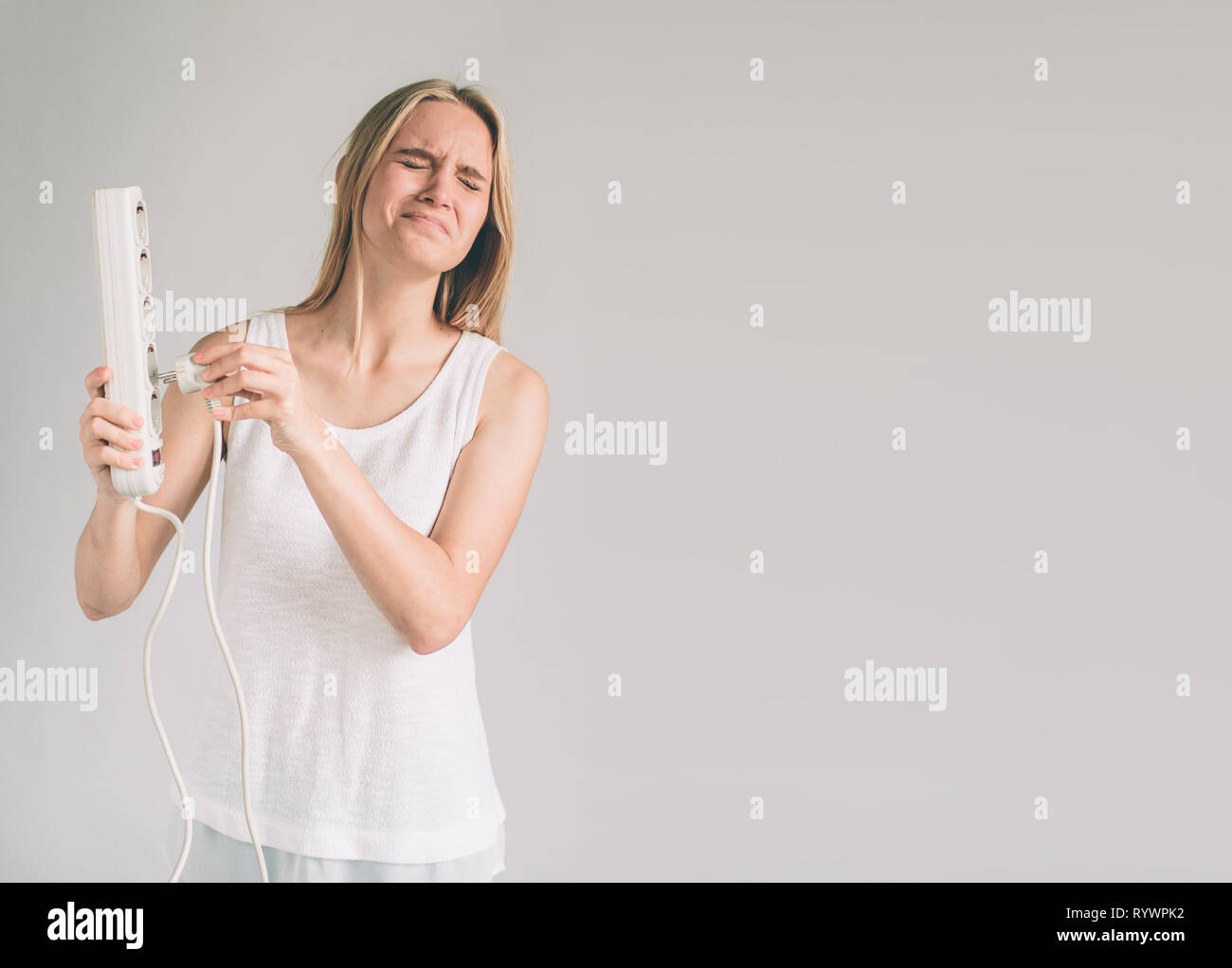 smiling happy woman using plug pull out socket showing saving electric ...