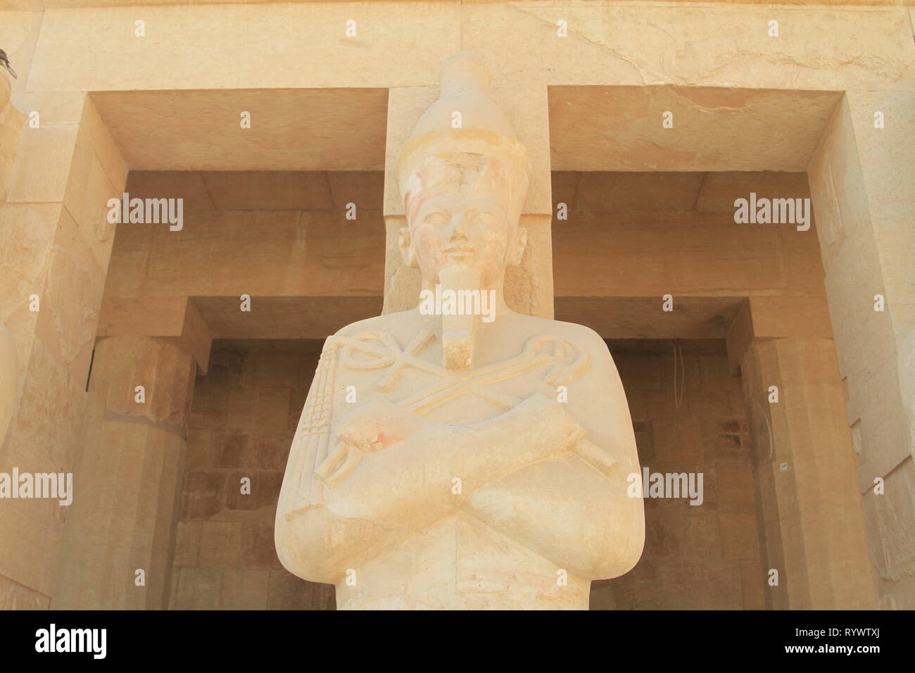Large statue of Hatshepsut in Osiris pose, midday, Temple of Hatshepsut ...