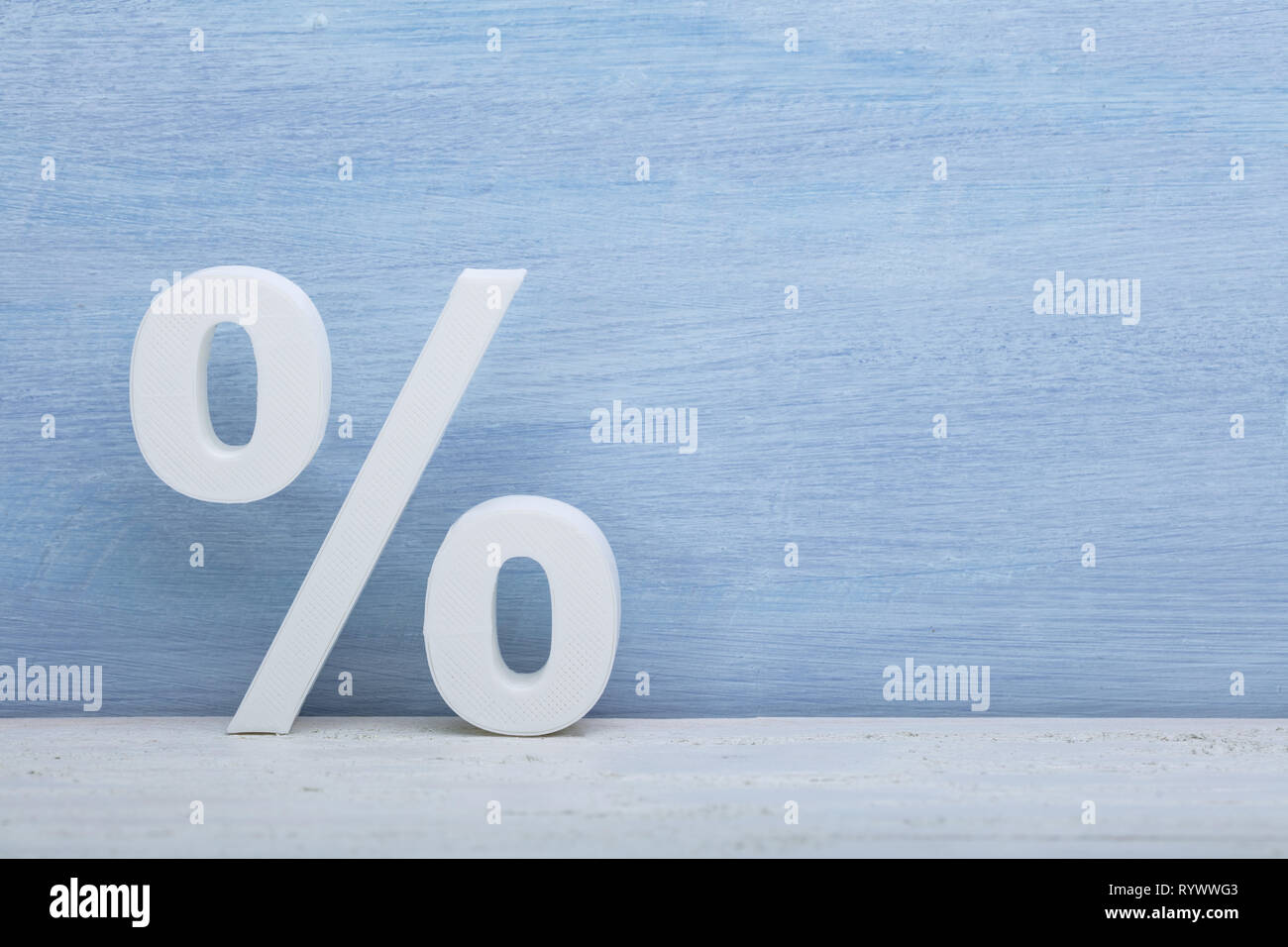 Close-up Of White Percentage Sign In Front Of Blue Wall Stock Photo - Alamy
