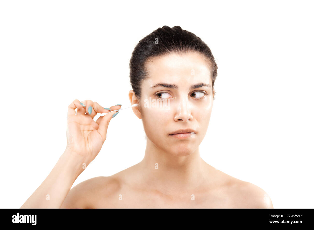 girl cleaning her ear with cotton stick and making grimace Stock Photo ...