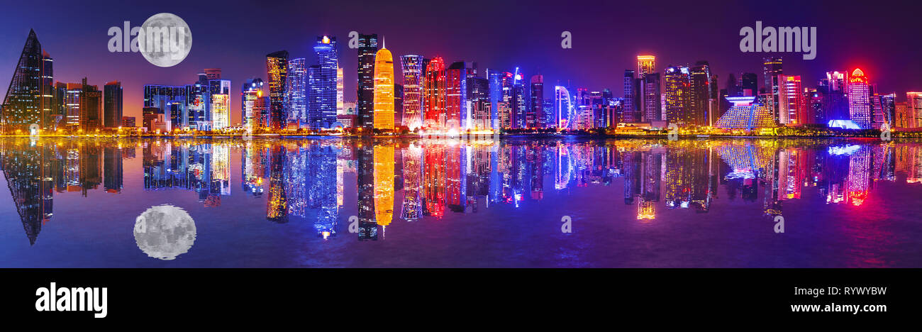 Banner panorama of Doha West Bay skyline lighting by night reflecting ...