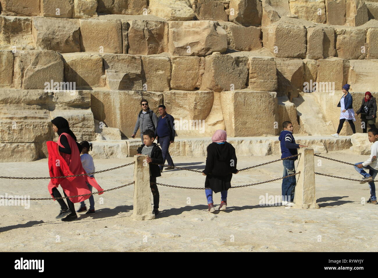Families, Children, Men, Woman, congregating at the base of the Pyramid ...