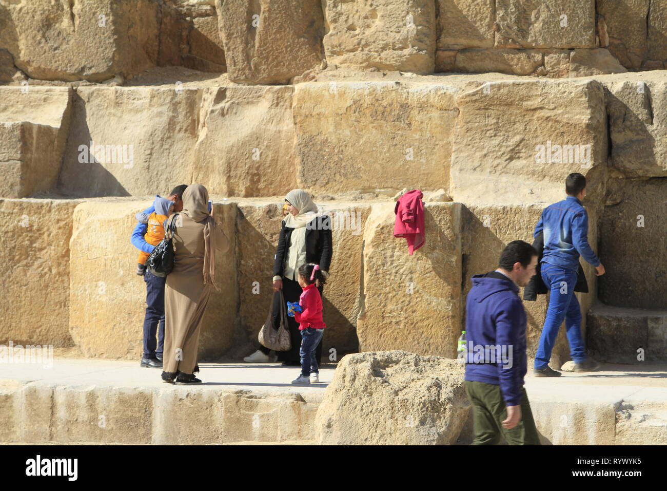 Families, Children, Men, Woman, congregating at the base of the Pyramid ...