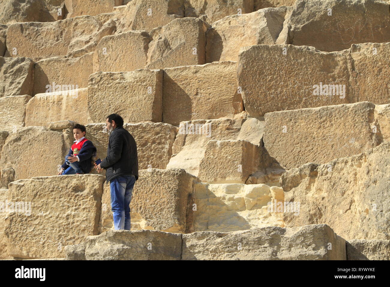 Families, Children, Men, Woman, congregating at the base of the Pyramid ...