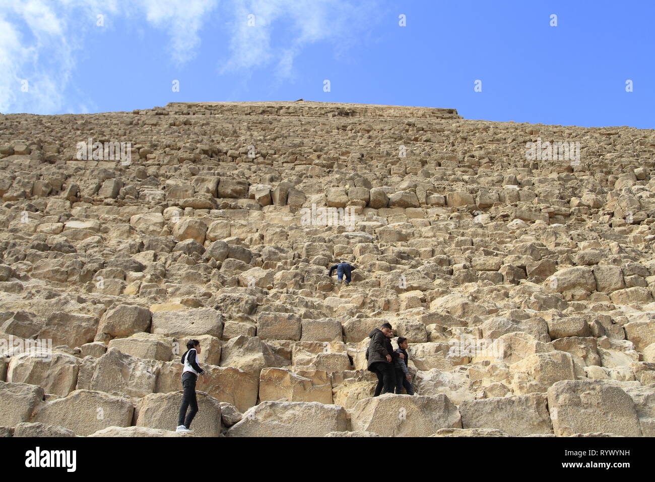 Kids climbing the Pyramid of Khafre despite the no climbing signs on ...