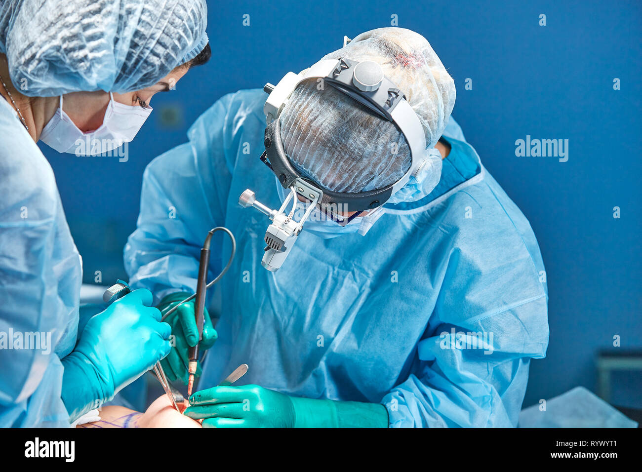 Team of surgeons makes an invasive operation. Portrait of surgeons ...