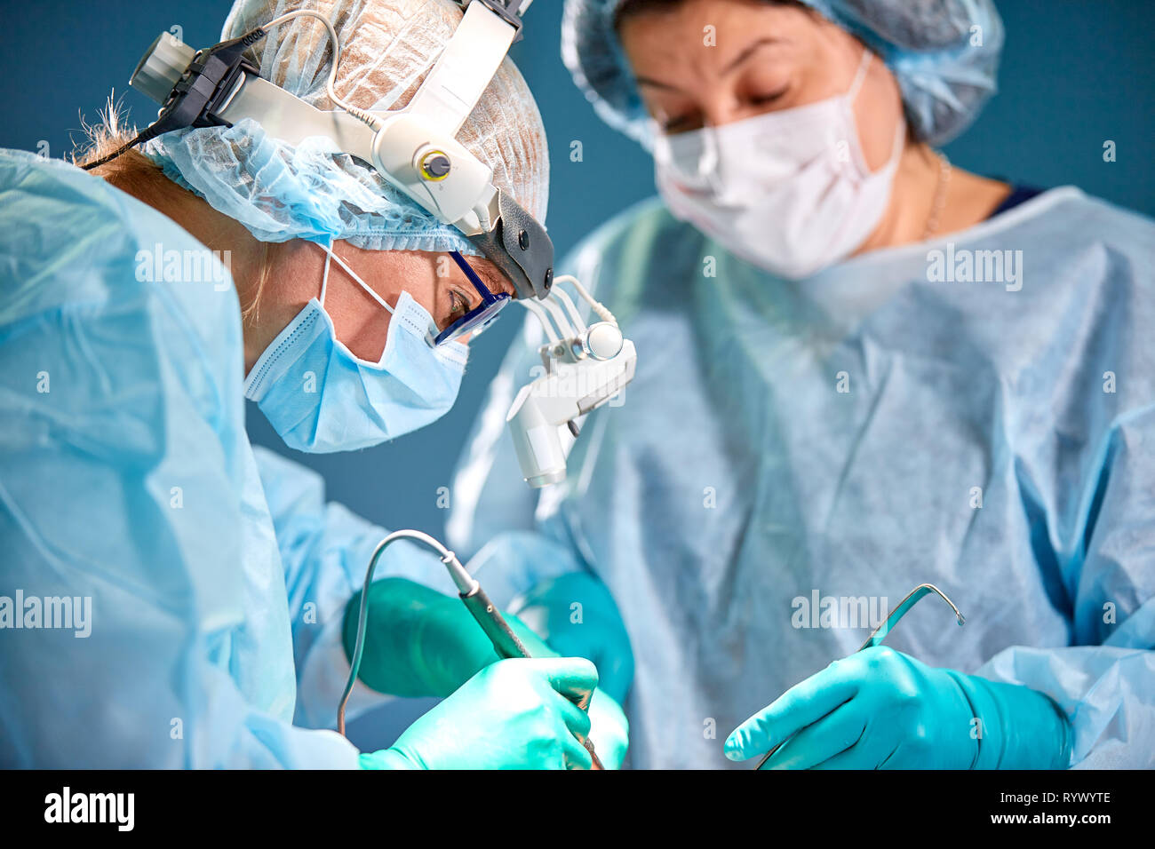 Portrait of a surgeon close-up. Surgeons operate on a patient. Tense ...