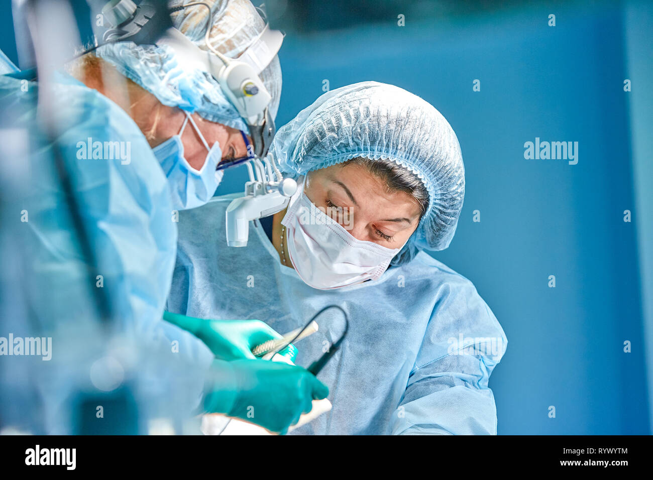 Portrait of a surgeon close-up. Surgeons operate on a patient. Tense ...