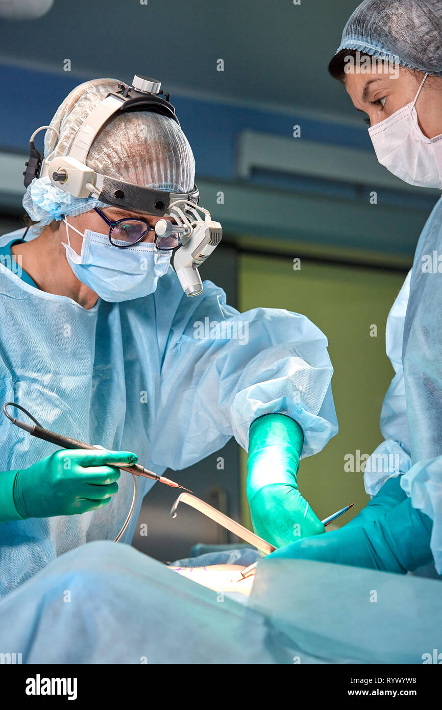 Team of surgeons makes an invasive operation. Portrait of surgeons ...
