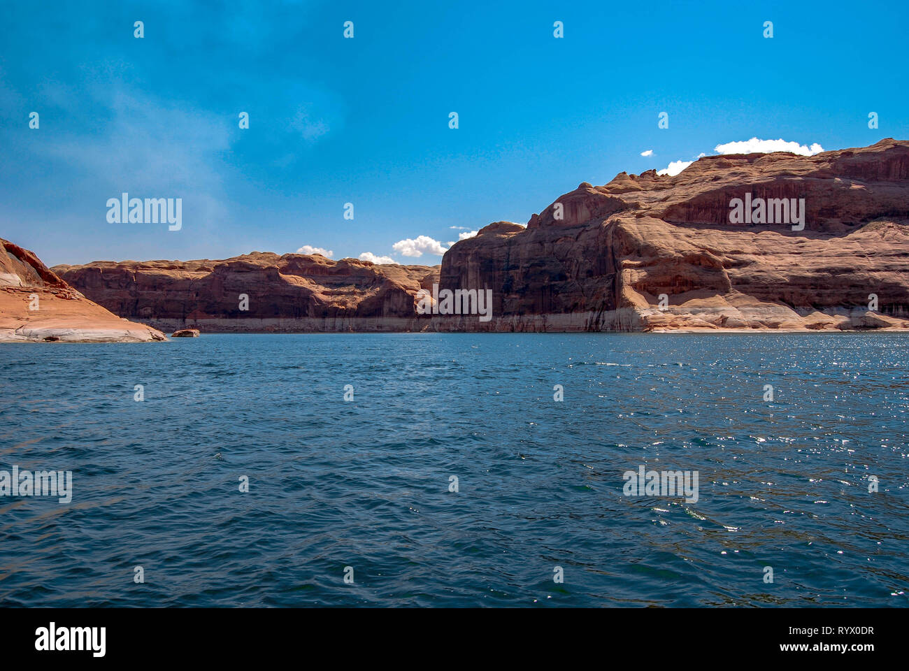 A warm summer afternoon at Lake Powell, Utah. Large red, orange ...