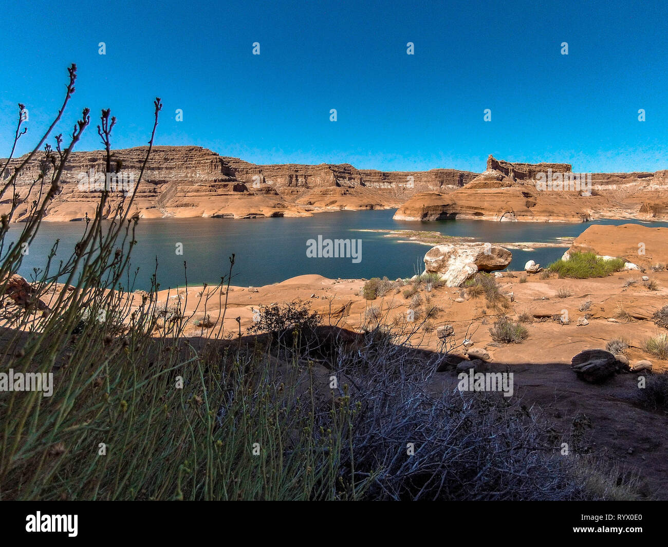 A warm summer afternoon at Lake Powell, Utah. Large red, orange ...