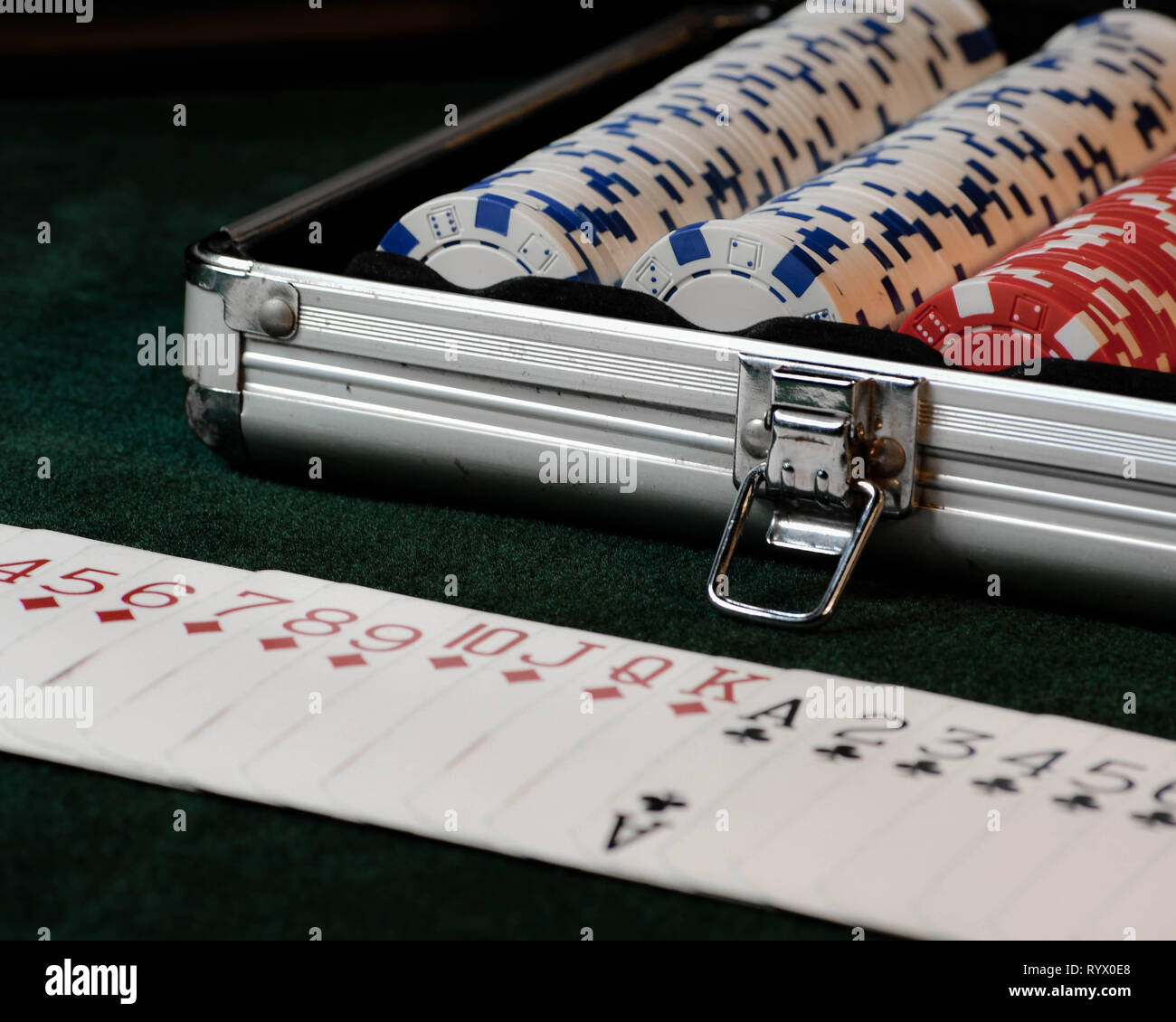 A poker scene with cards, chips and green felt. Poker game, dark ...