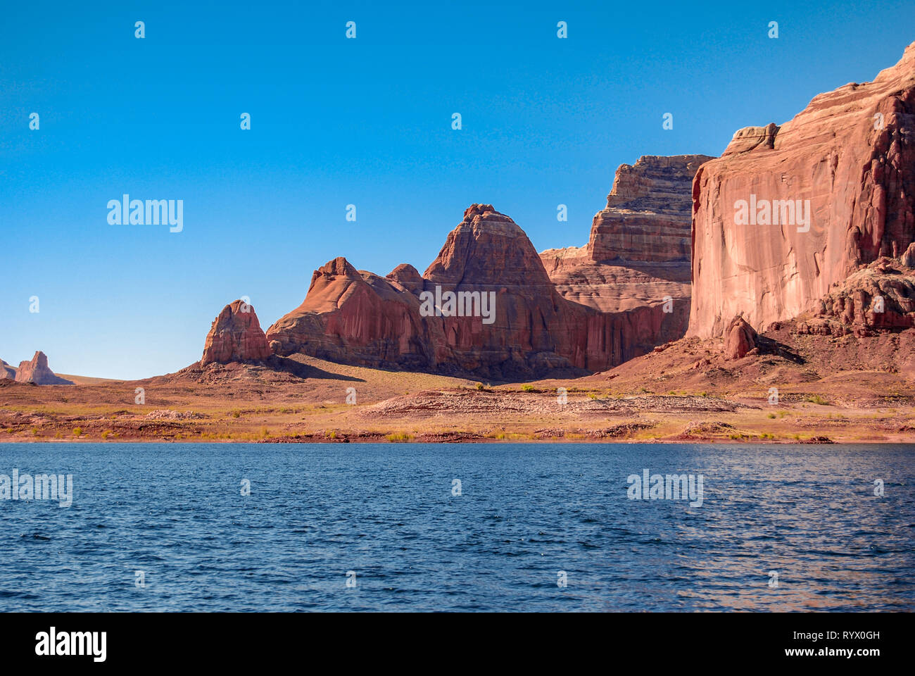 A warm summer afternoon at Lake Powell, Utah. Large red, orange ...