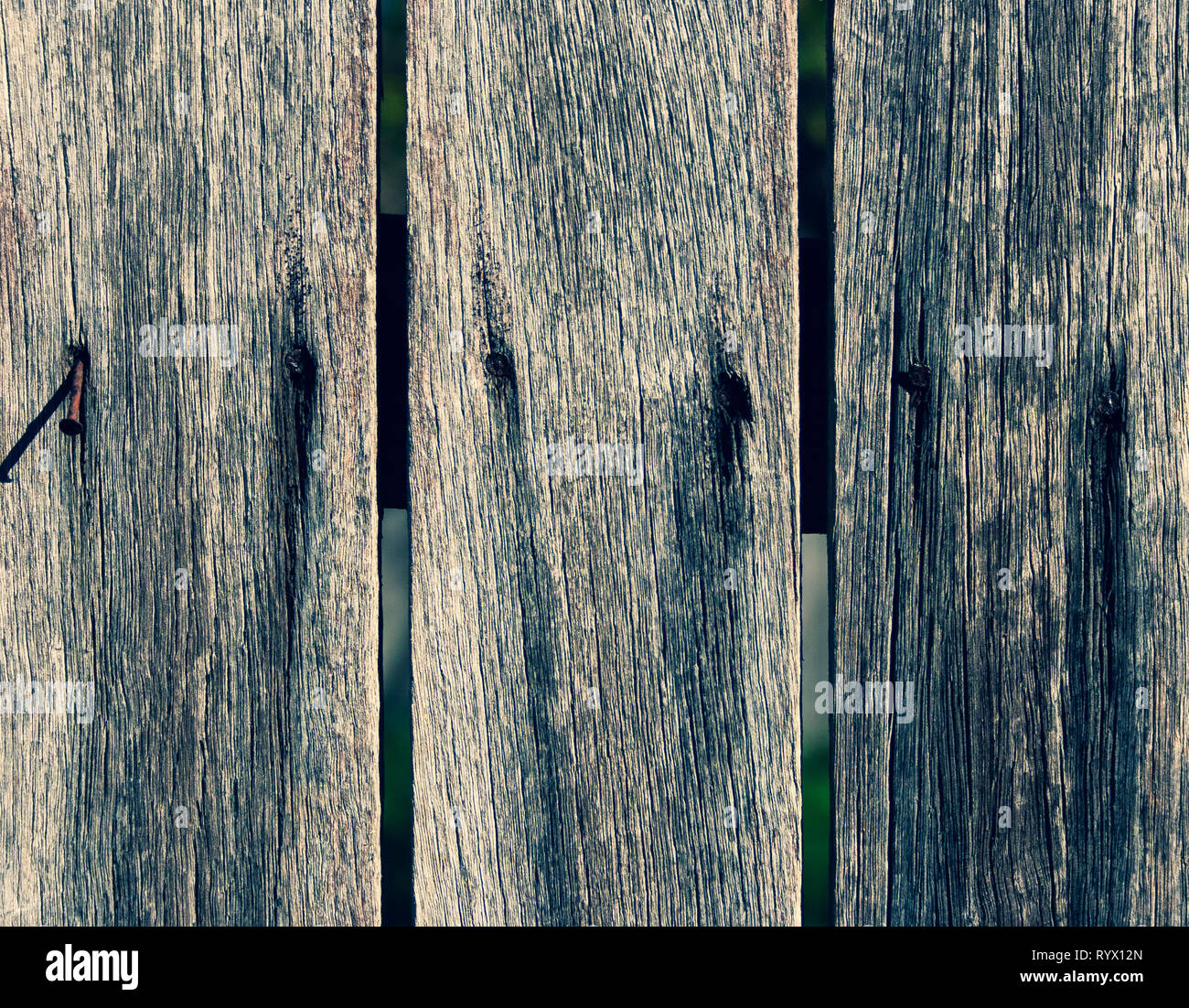 Worn timber fence on a sunny day Stock Photo - Alamy