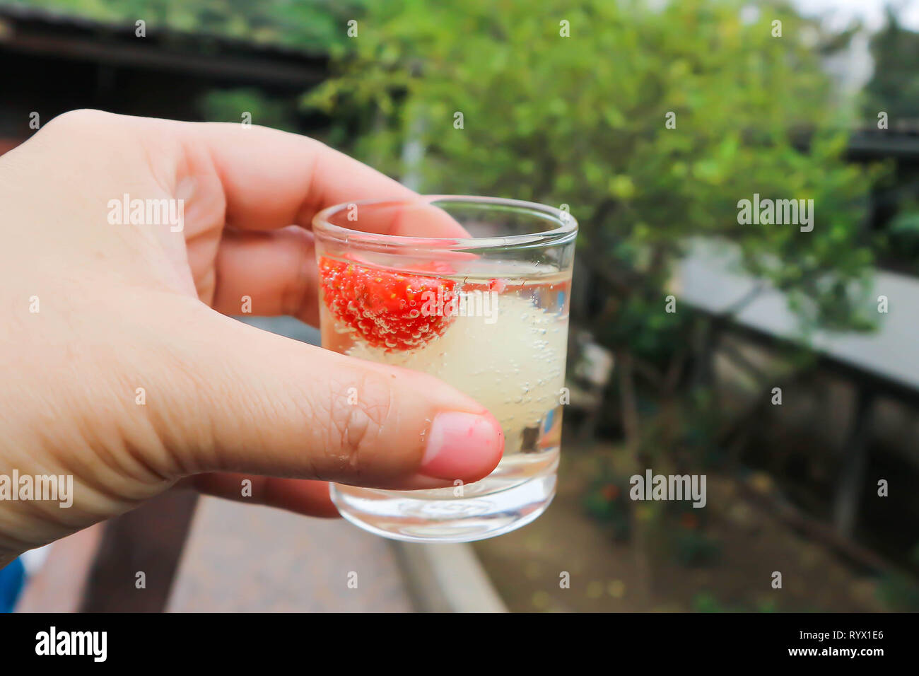 cocktail with strawberry and rambutan Stock Photo - Alamy