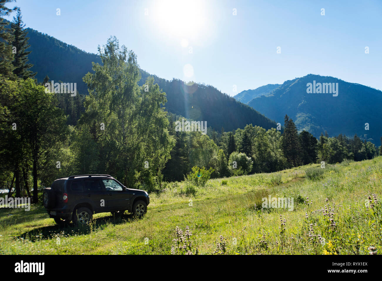 Travel concept with big 4x4 car against sunset and mountains. photo of ...