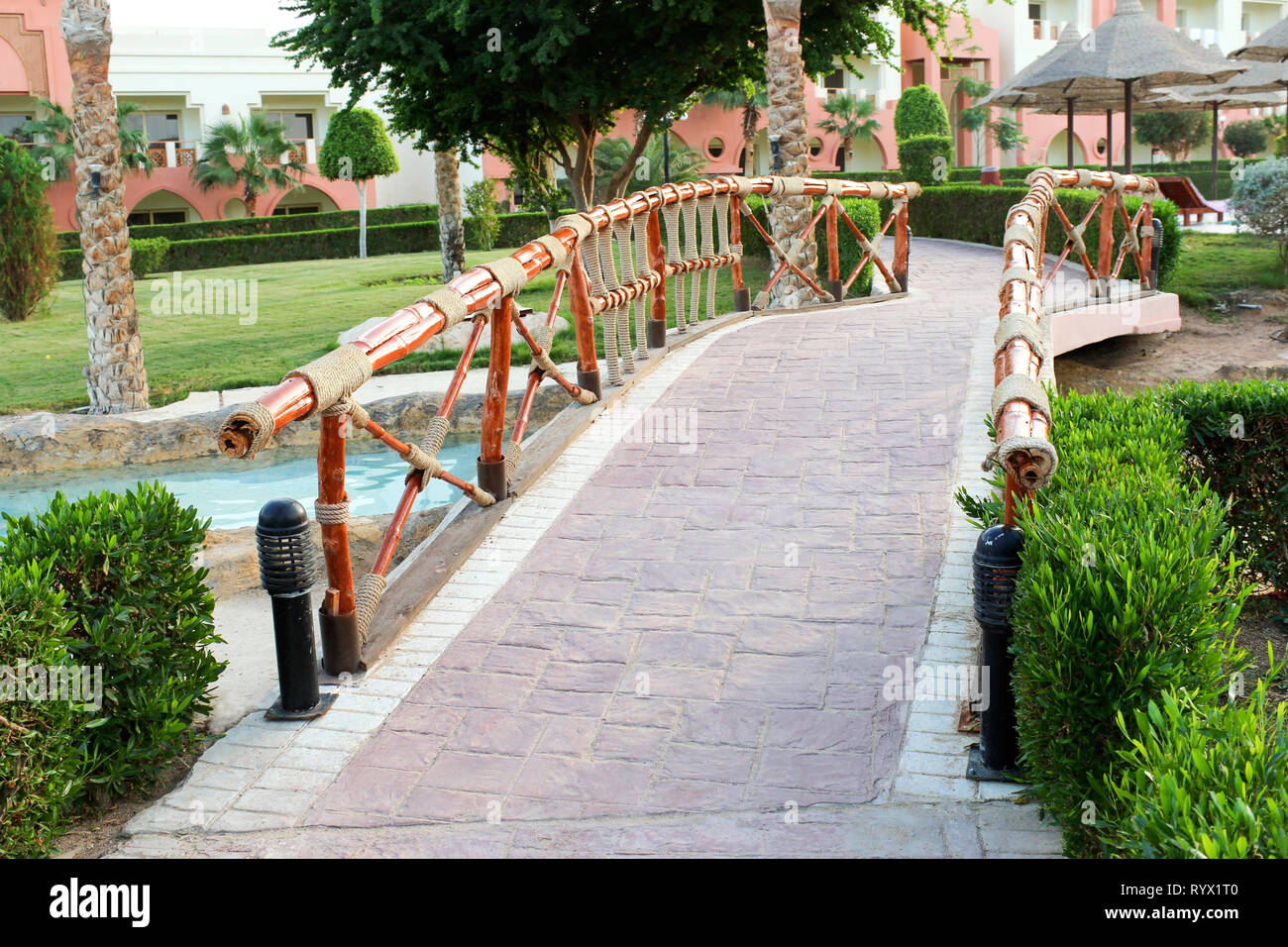 Stone bridge railing with bamboo over a stream Stock Photo - Alamy