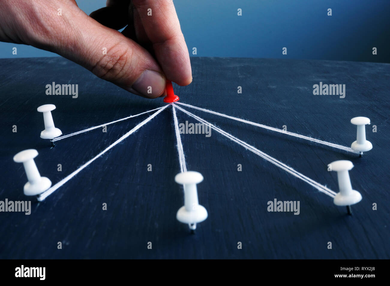 Hand holding push pin. Be boss and leader Stock Photo - Alamy